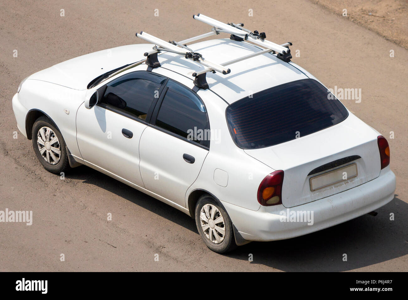 View from above of new shiny white expensive car with dark windows and ...