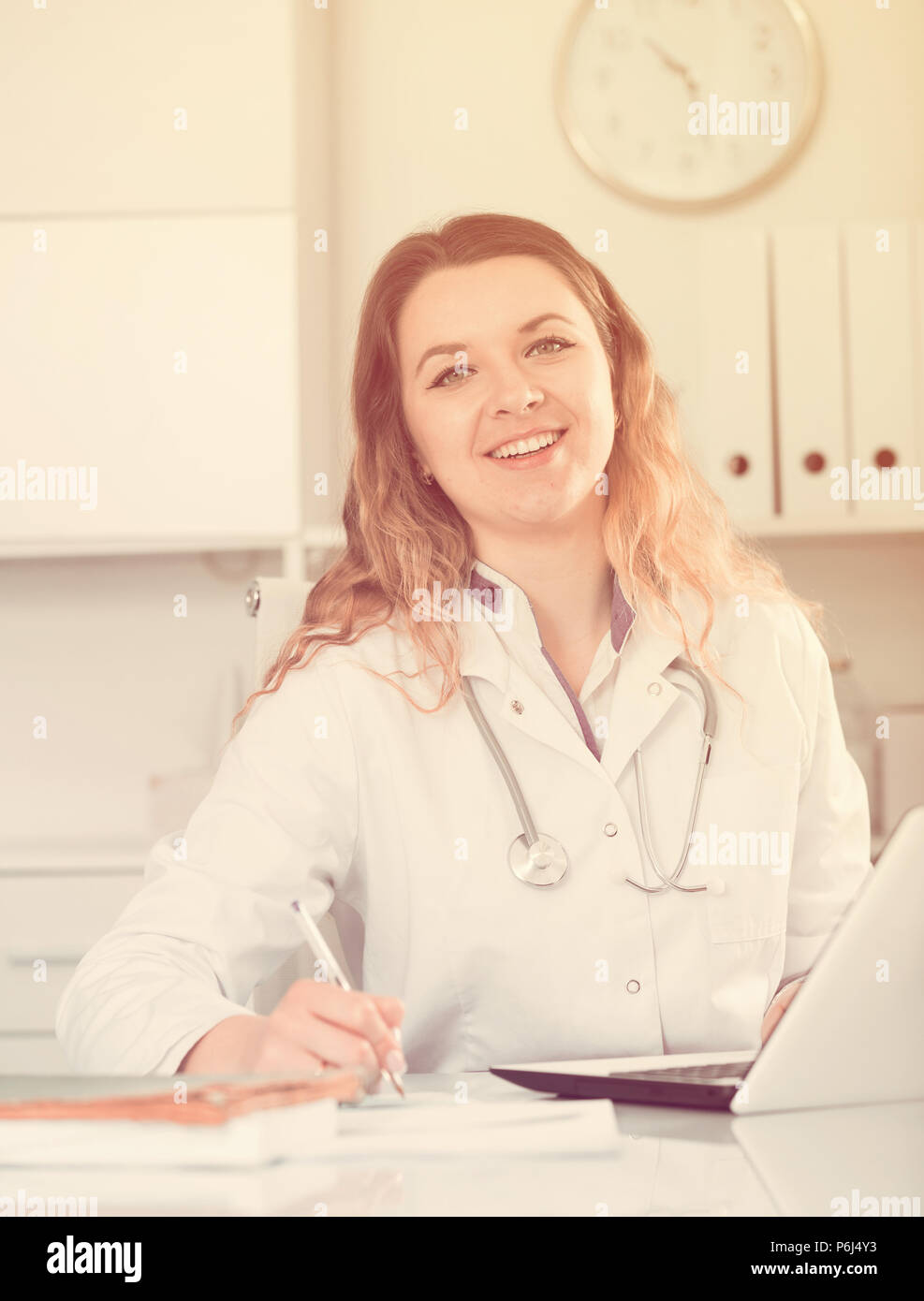 Young nurse filling documents hi-res stock photography and images - Alamy