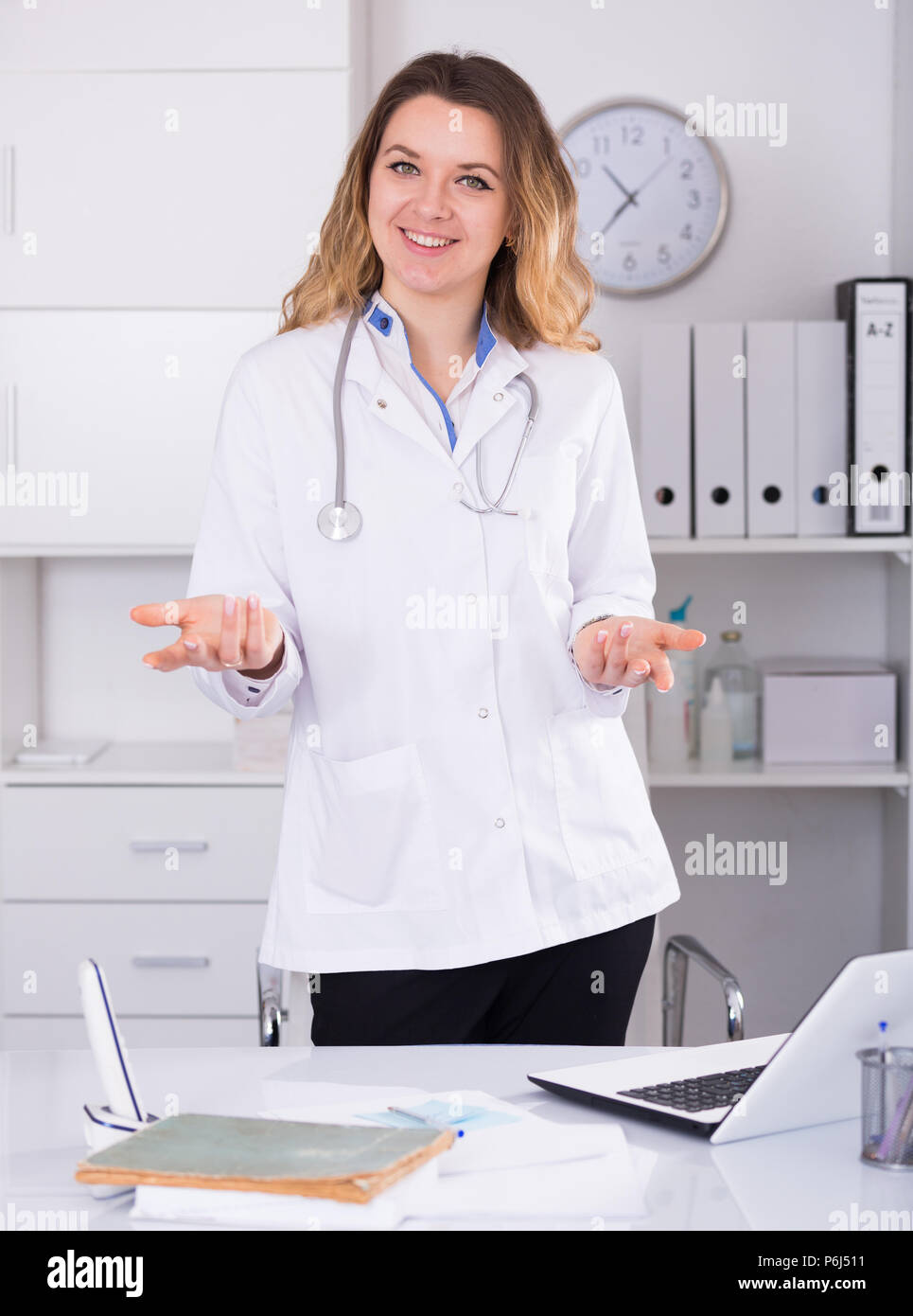 Young smiling female working in medical Center at the laptop Stock ...