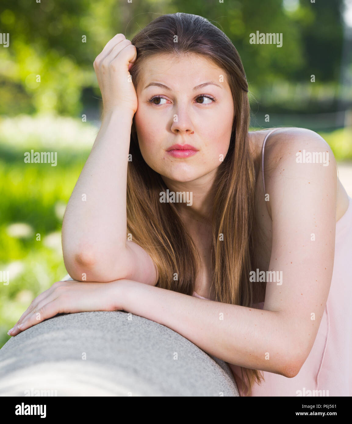 Female is feeling distressed and lonely alone at the park Stock Photo ...
