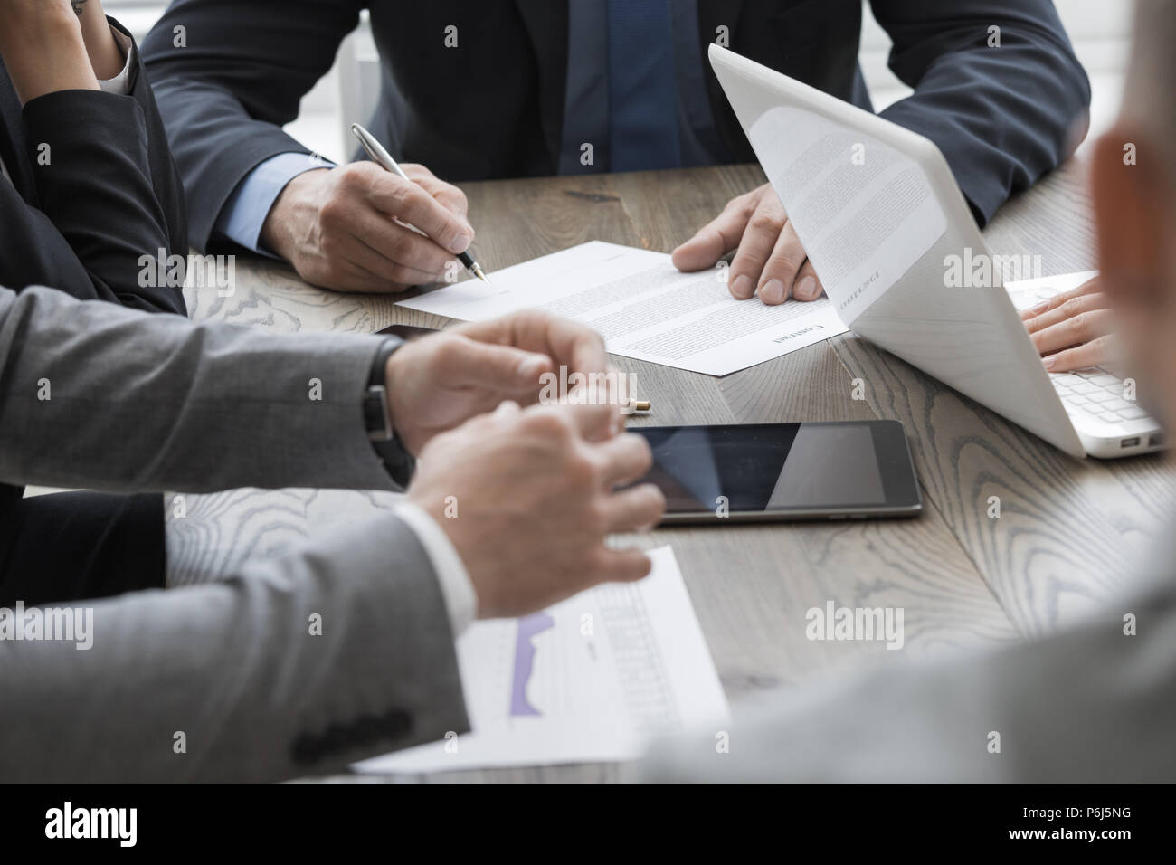 Business man sign contract on the desk at meeting Stock Photo - Alamy