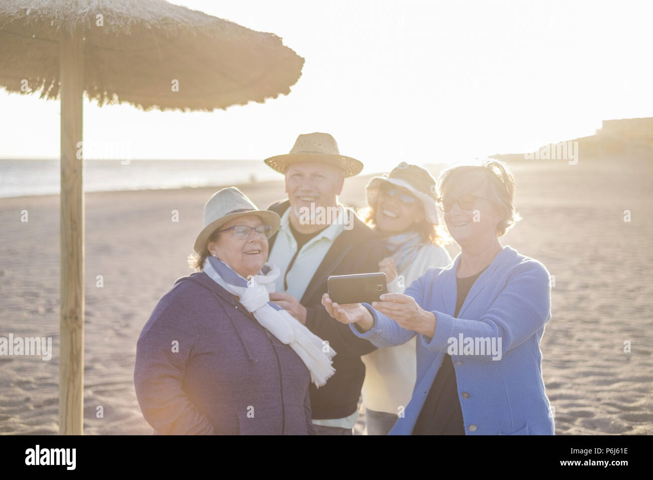 mixed ages caucasian group of four people three women and one man stay ...
