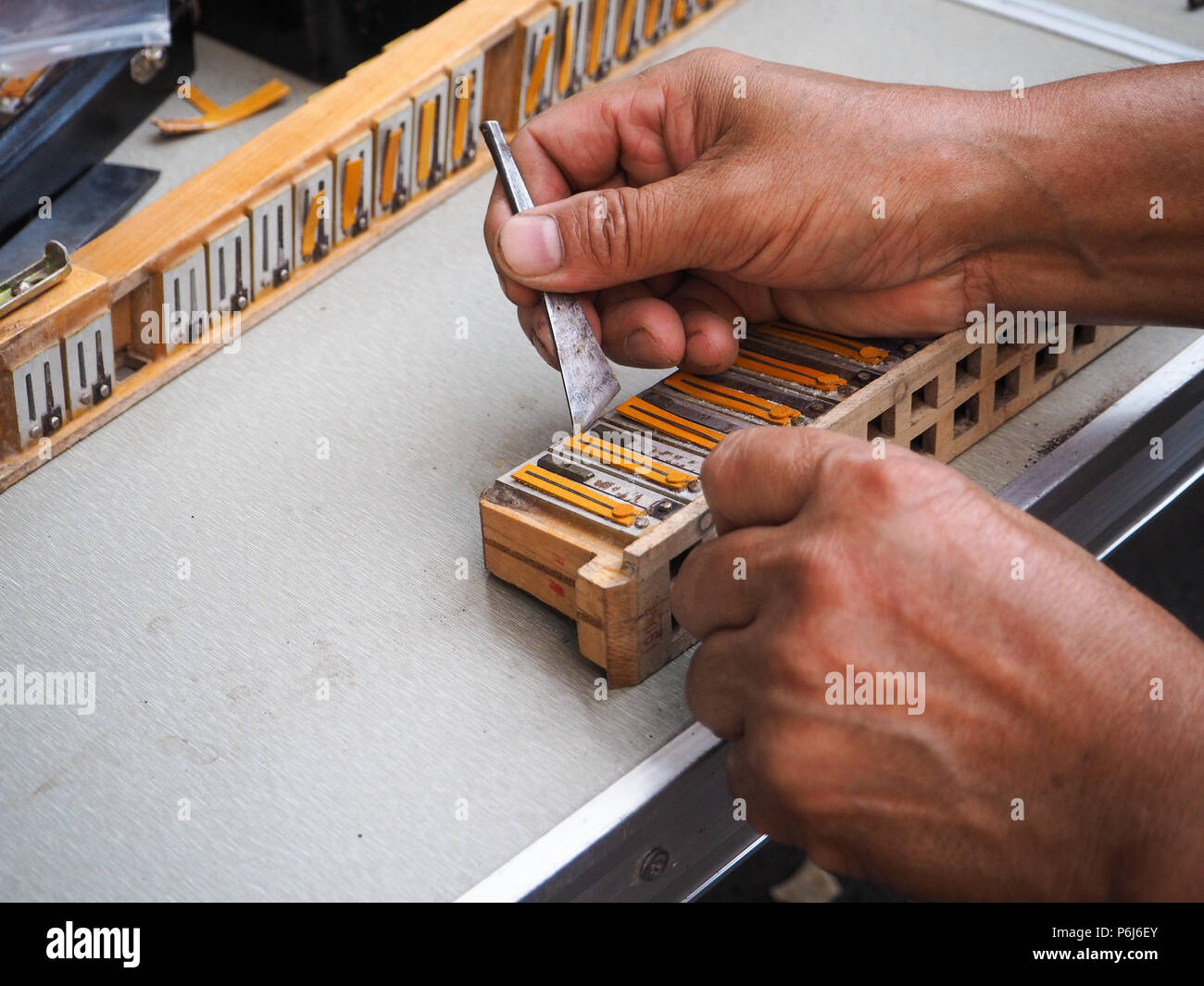 Old man repairing the reed blocks of a vintage accordion, Beijing ...
