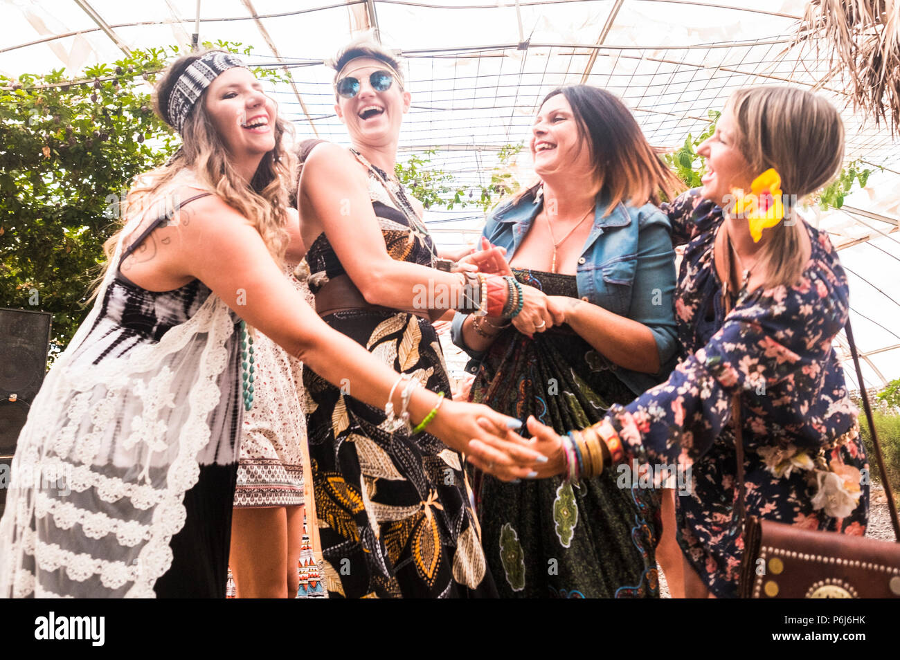 beautiful group of caucasian young ladies with ippy clothes have fun ...