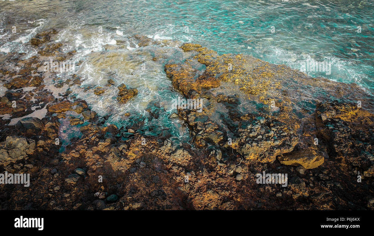beautiful aerial view of ocean wave. blue colors and white foam on a ...