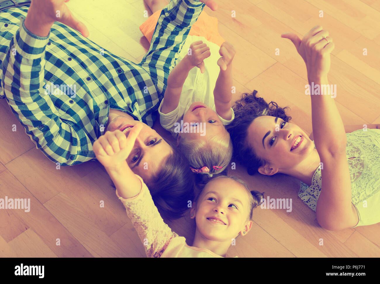 Family values: portrait of happy parents 30-35 years old with little ...