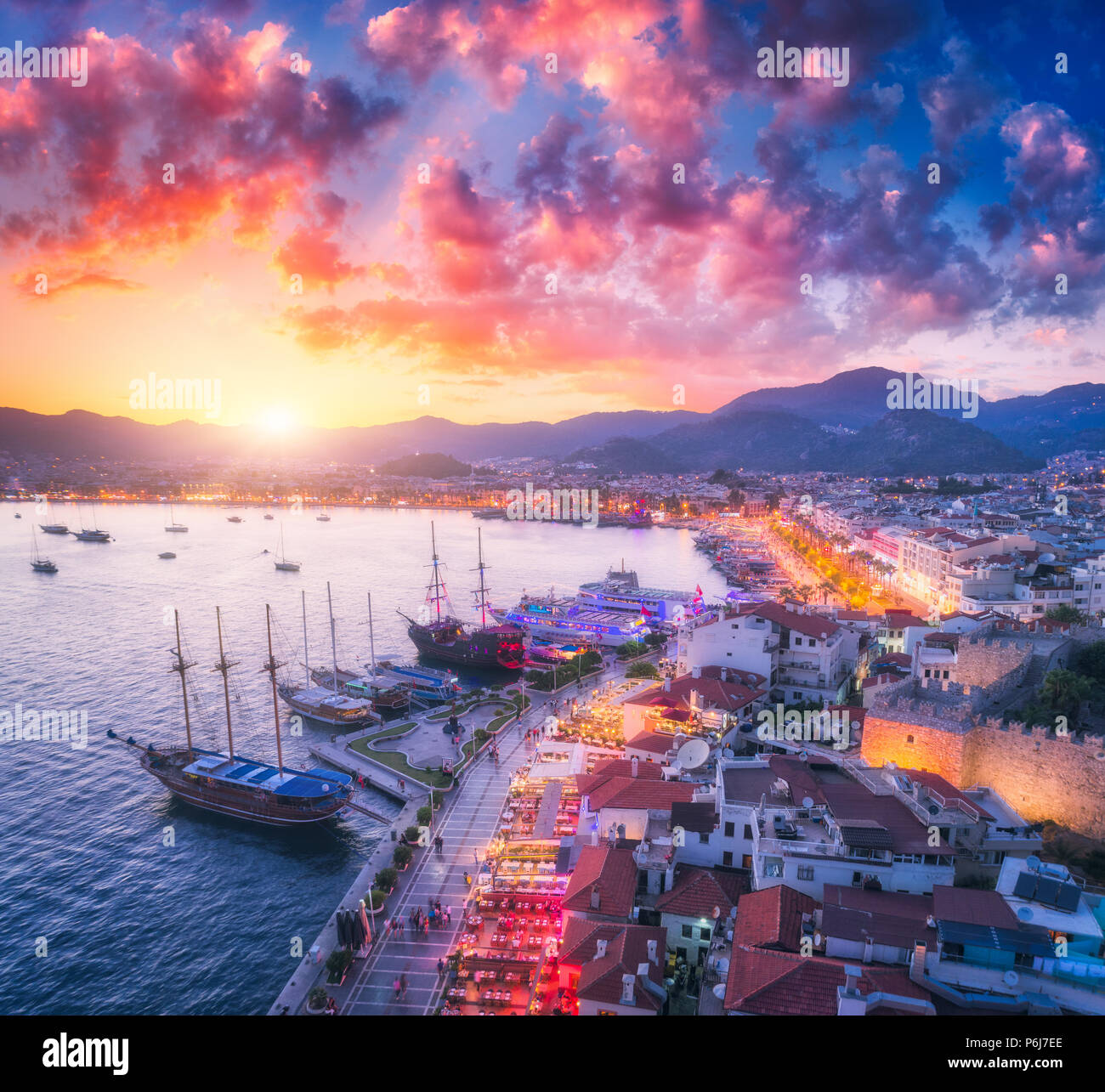 Aerial view of boats and yachts and beautiful architecture at amazing sunset in Marmaris, Turkey ...