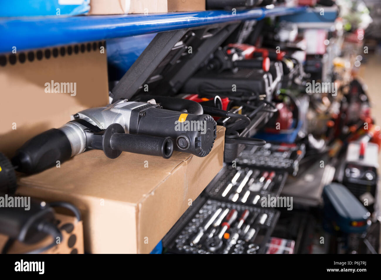 Photo of new modern tools on showcase in the store Stock Photo - Alamy