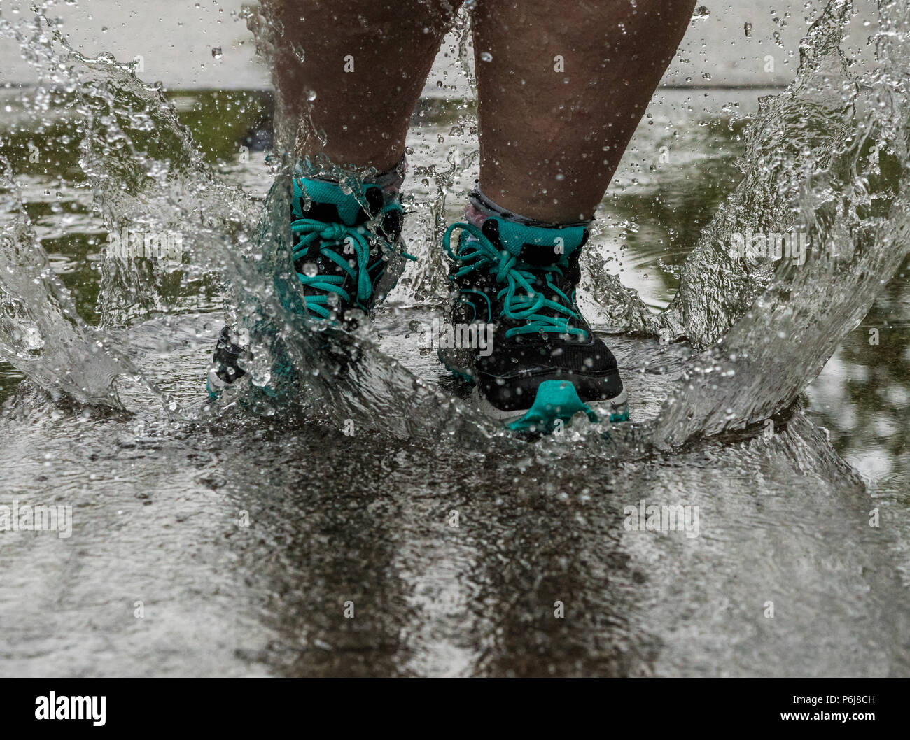 Splashing in a puddle hi-res stock photography and images - Alamy