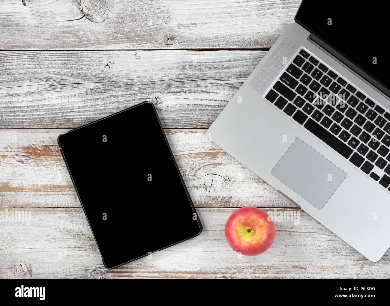 Back to school with modern technology concept on white rustic desktop ...