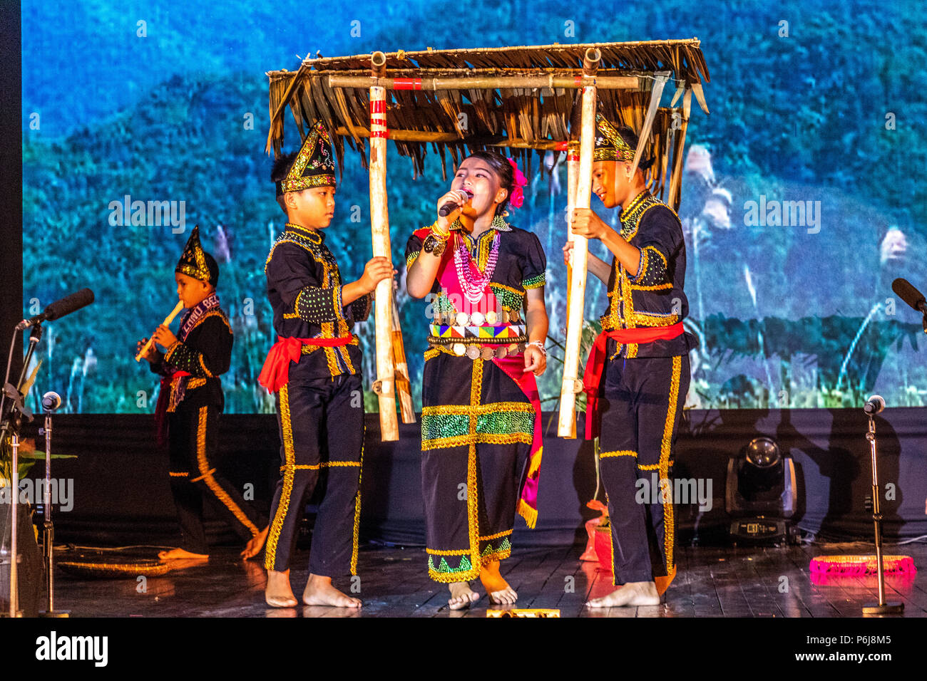 Young people in traditional costume at KDCA building in Kota Kinabalu ...