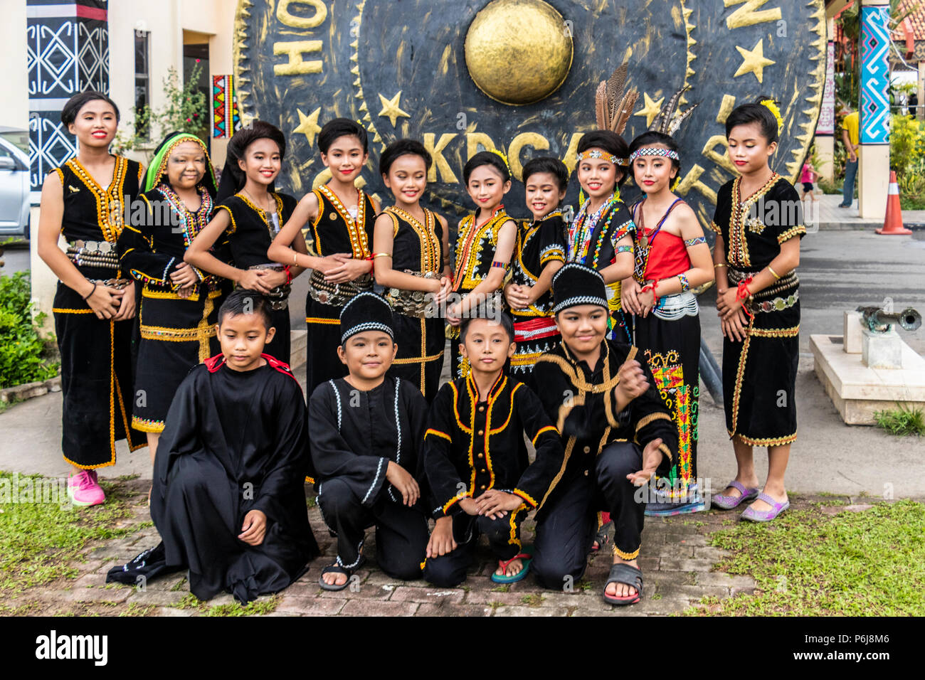 Young people in traditional costume at KDCA building in Kota Kinabalu ...