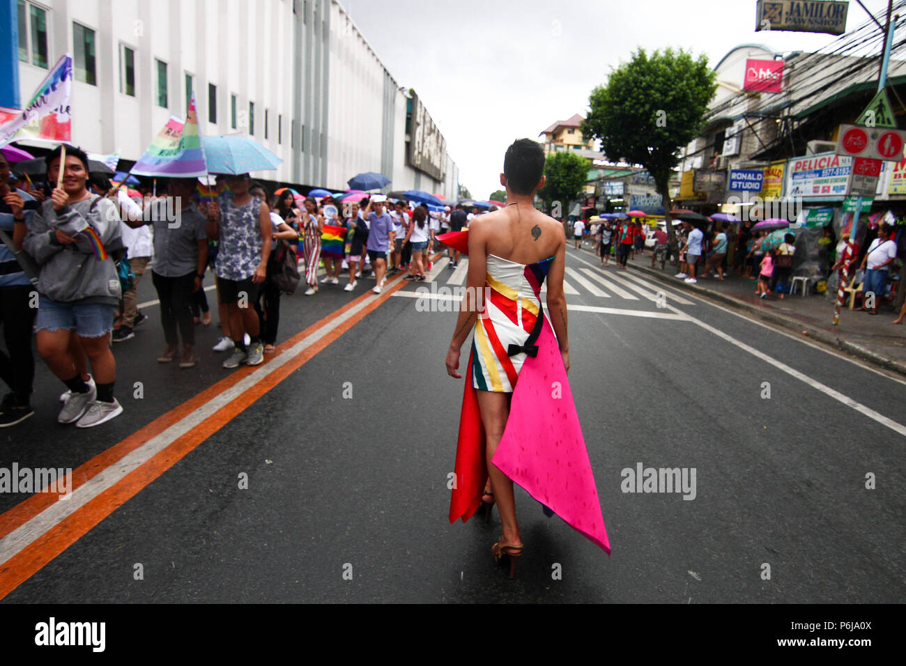 Philippines. 30th June, 2018. A pride march participant wearing a dress ...