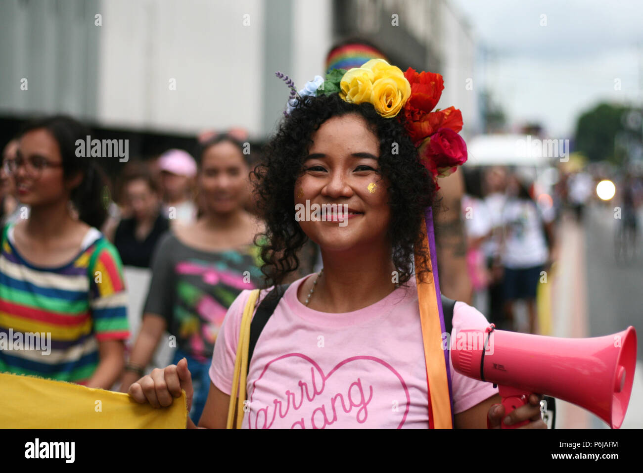 Philippines. 30th June, 2018. A Pride March participant pose for the ...