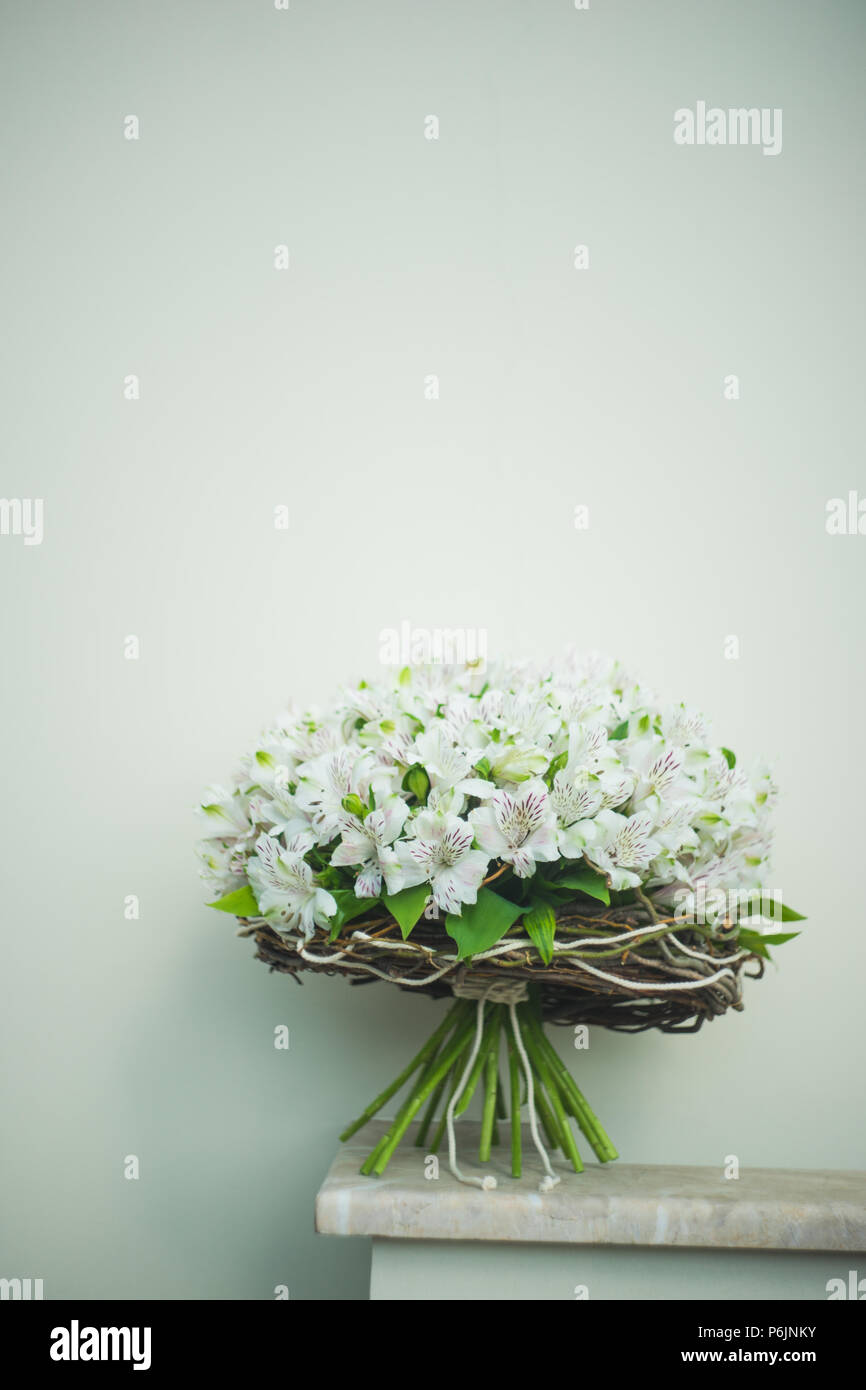 White Lily of the Incas in a bunch on rustic background with copyspace ...