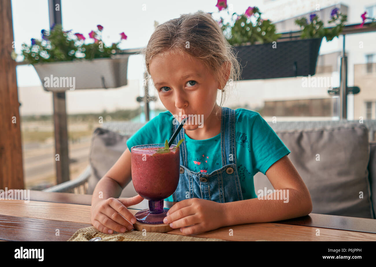 child drinks a cocktail in a restaurant Stock Photo - Alamy