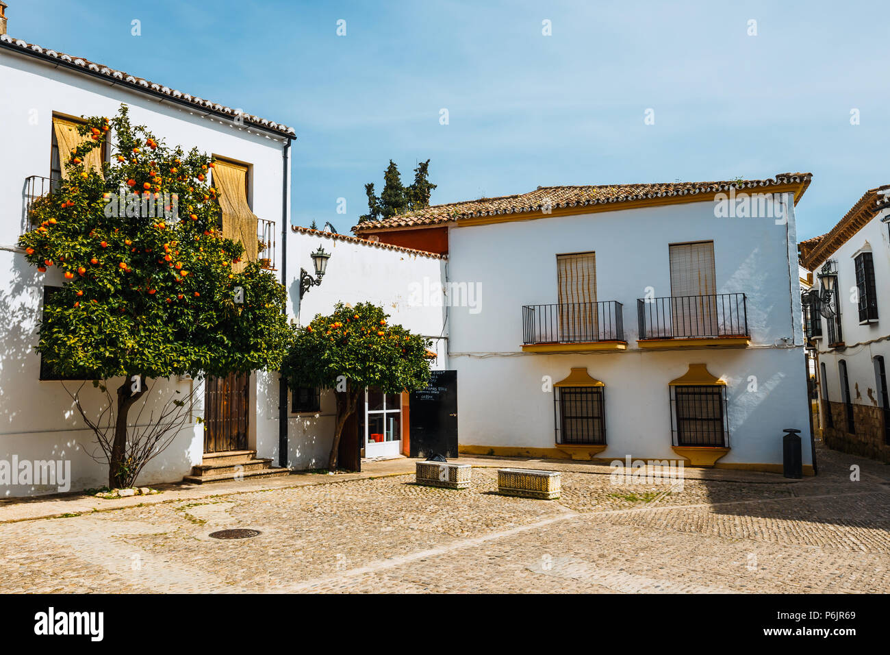 view of typical street in historic district of Ronda, Spain Stock Photo ...
