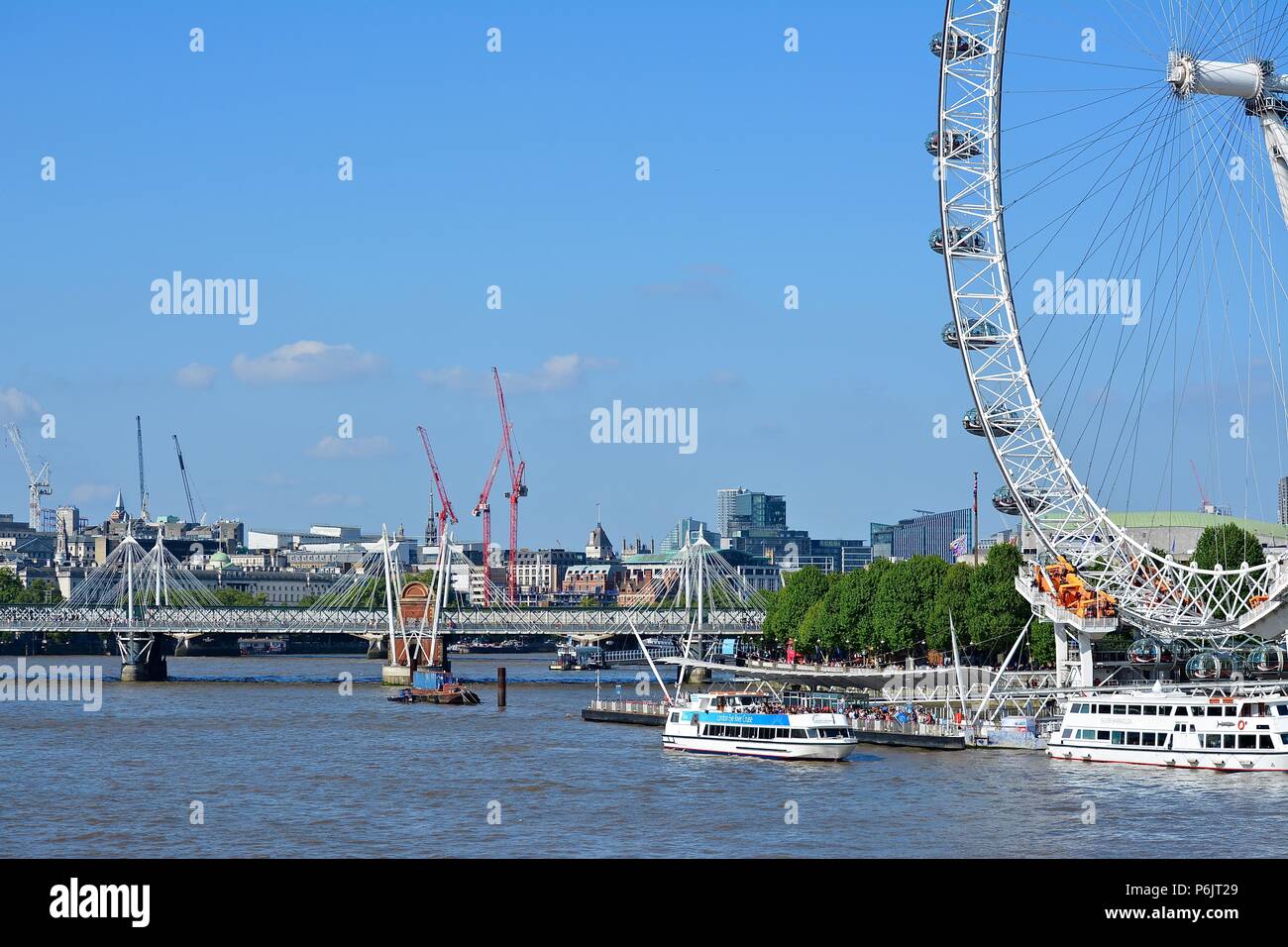 The iconic London Eye observation wheel along the River Thames, London ...