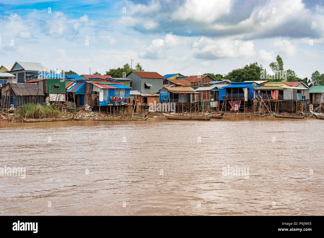 Houses at the bank of the Mekong river in small Akreiy Ksatr village in ...