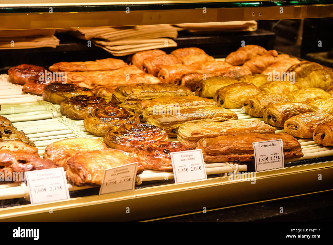 Bakery window in Paris showing delicious confectionery and their prices ...