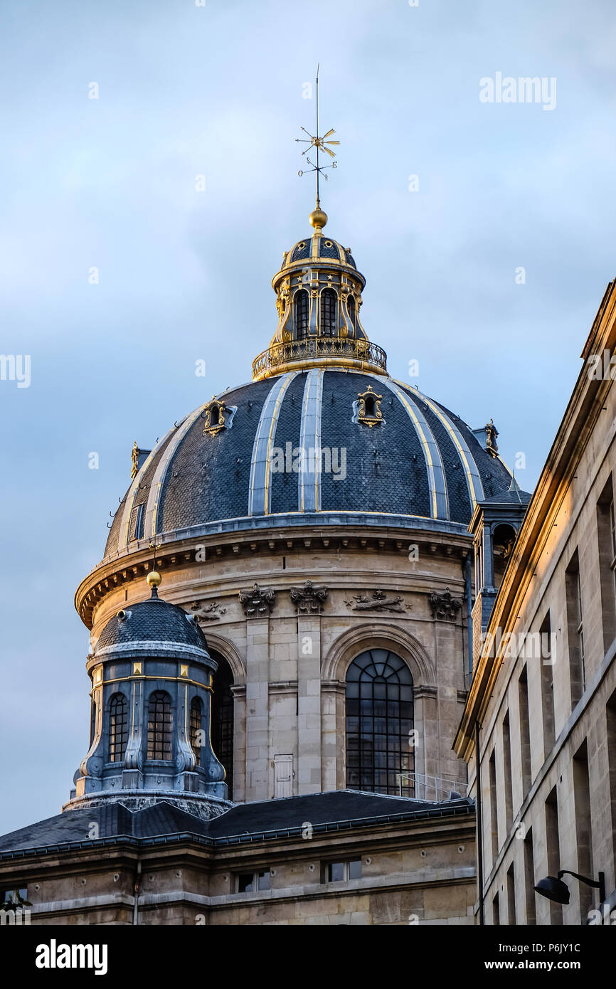 Blue dome under golden sunset light in Paris, France. Golden details ...