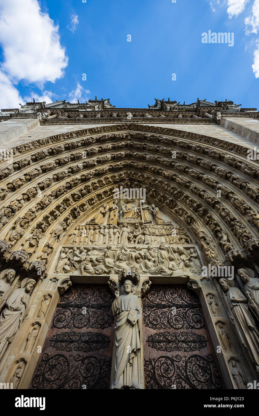 Wide angle photo of entrace gates of the Notre Dame Cathedral in Paris ...