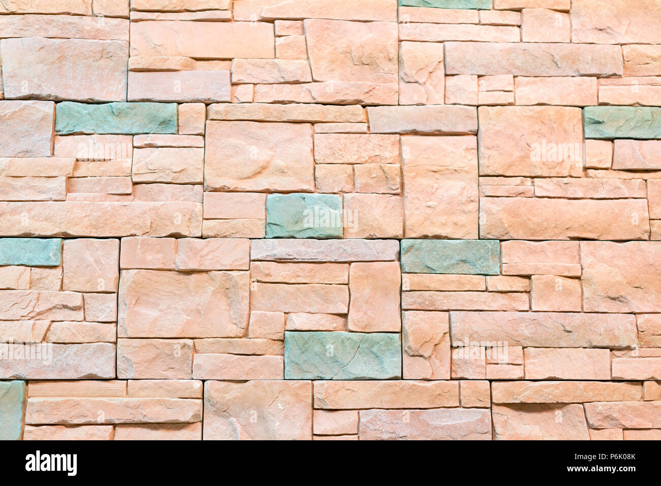 Decorative wall of pink stone. background Stock Photo - Alamy