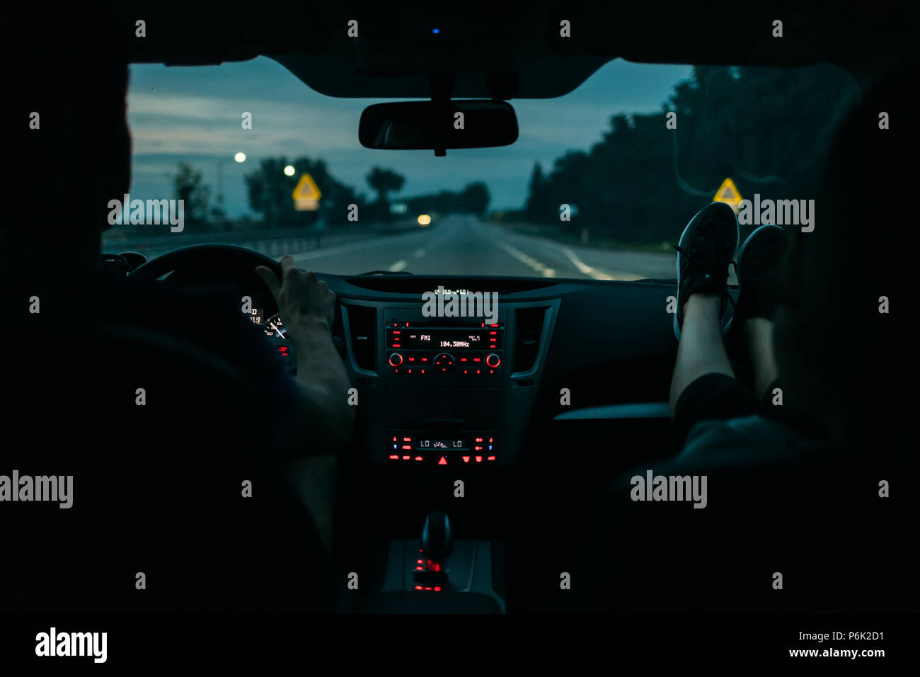 A couple in the car on the way to home. Back view Stock Photo - Alamy