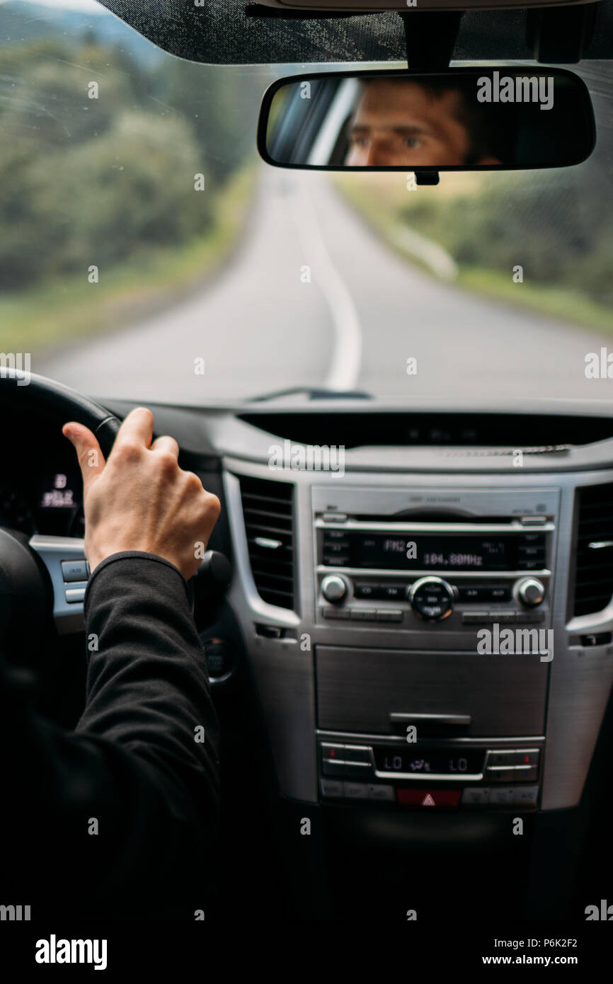Man driving a car. Back view Stock Photo - Alamy