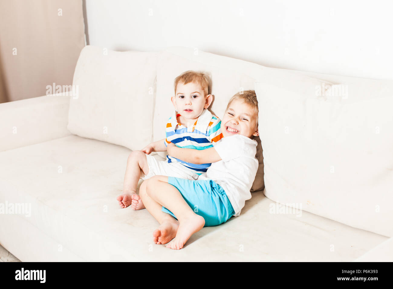 Two brothers hugging Stock Photo - Alamy