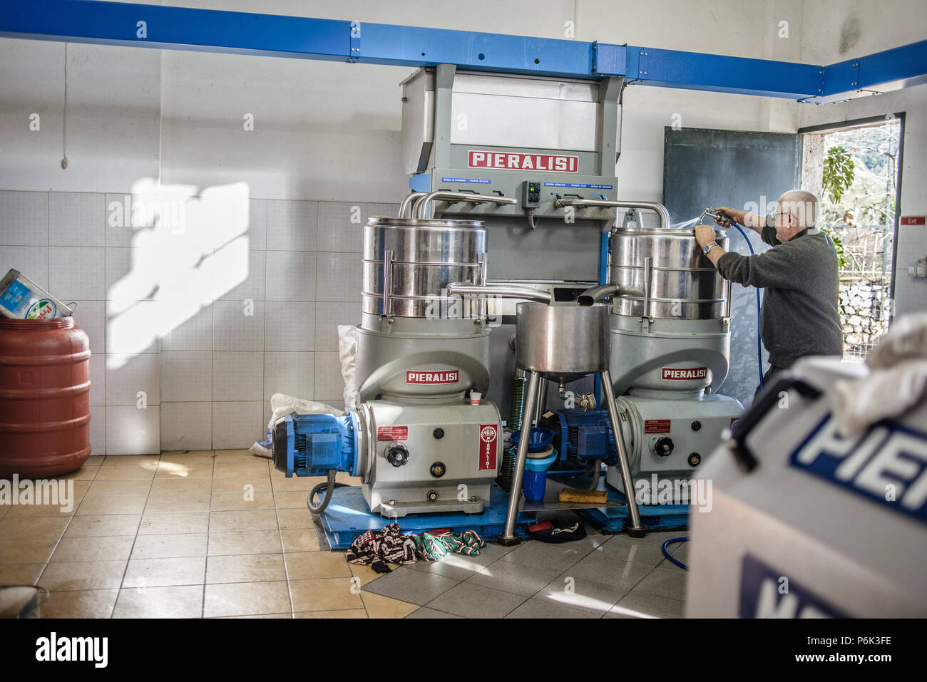 The working process at extra virgin olive oil factory near Saranda ...
