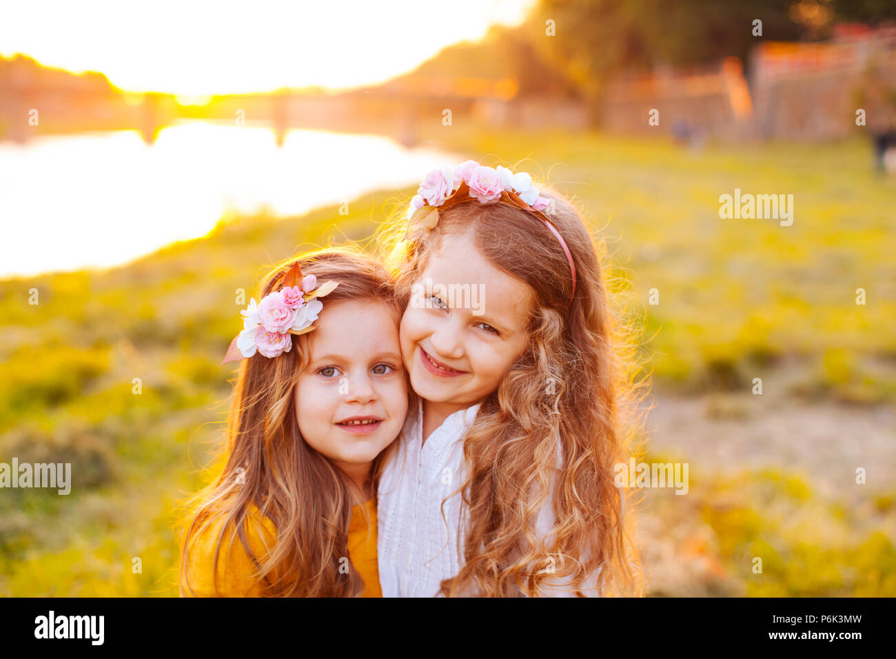 Two pretty friends hugging Stock Photo - Alamy