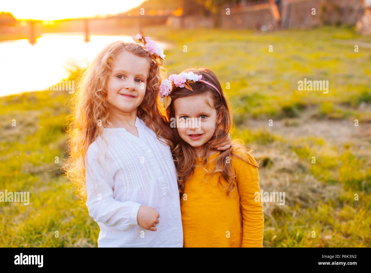 Two girls in green park Stock Photo - Alamy