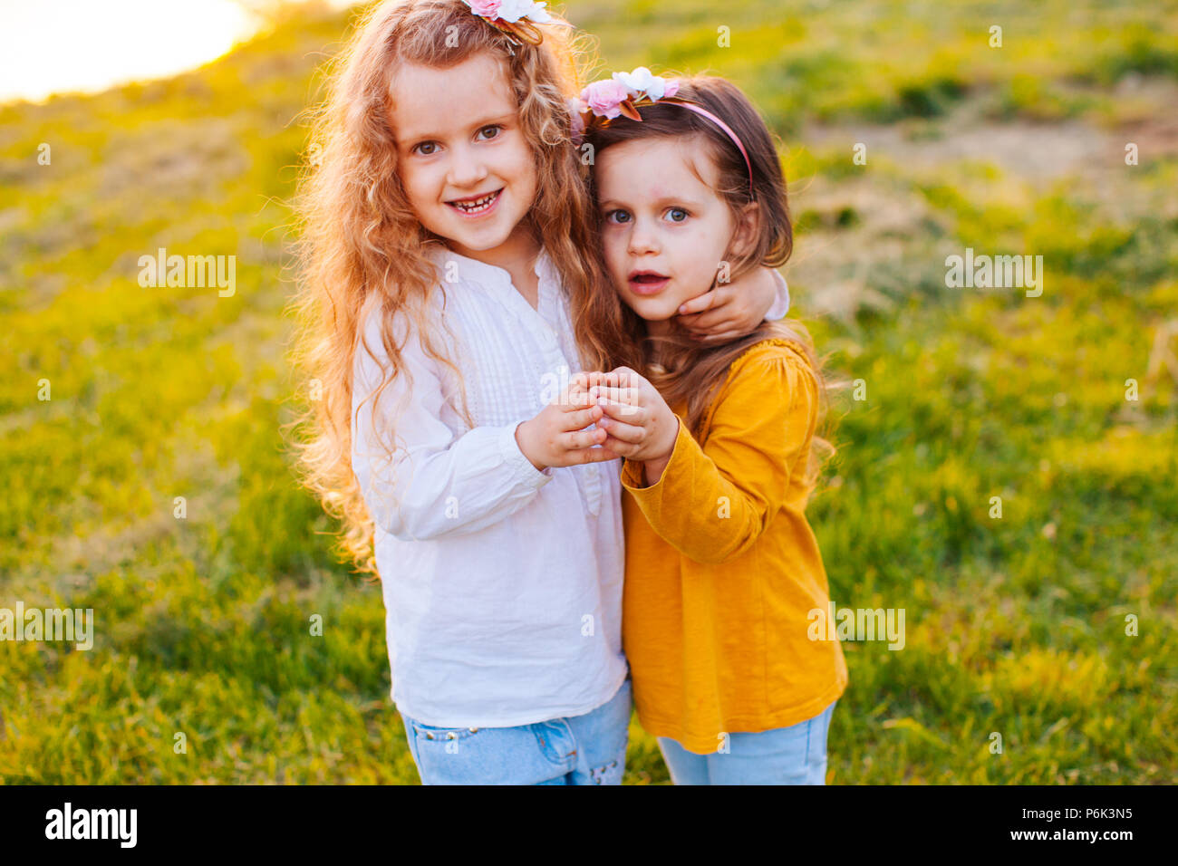 Two girls making heart Stock Photo - Alamy