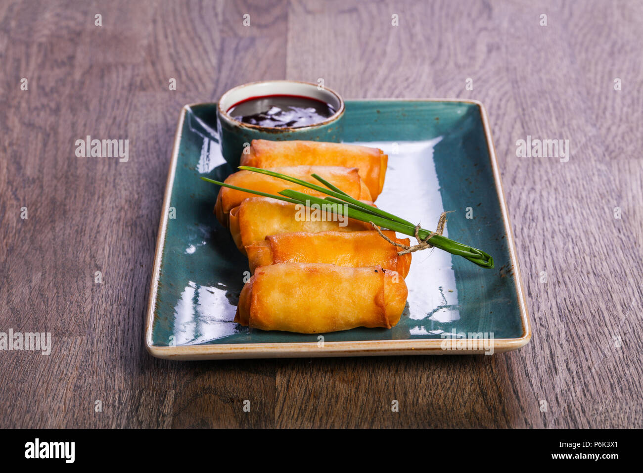 Spring roll with sauce served onion Stock Photo - Alamy