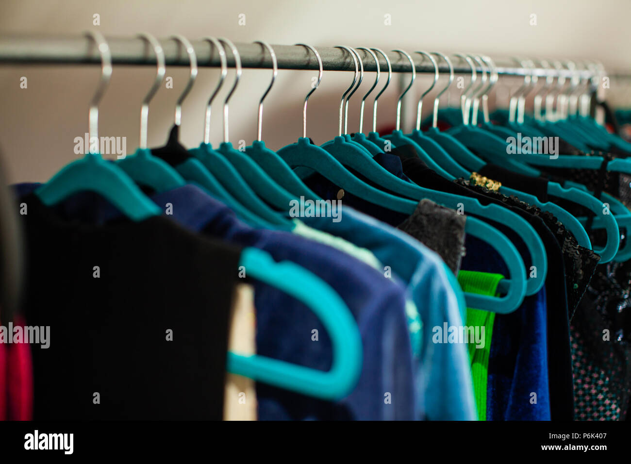 Sorted clothes in the wardrobe Stock Photo - Alamy