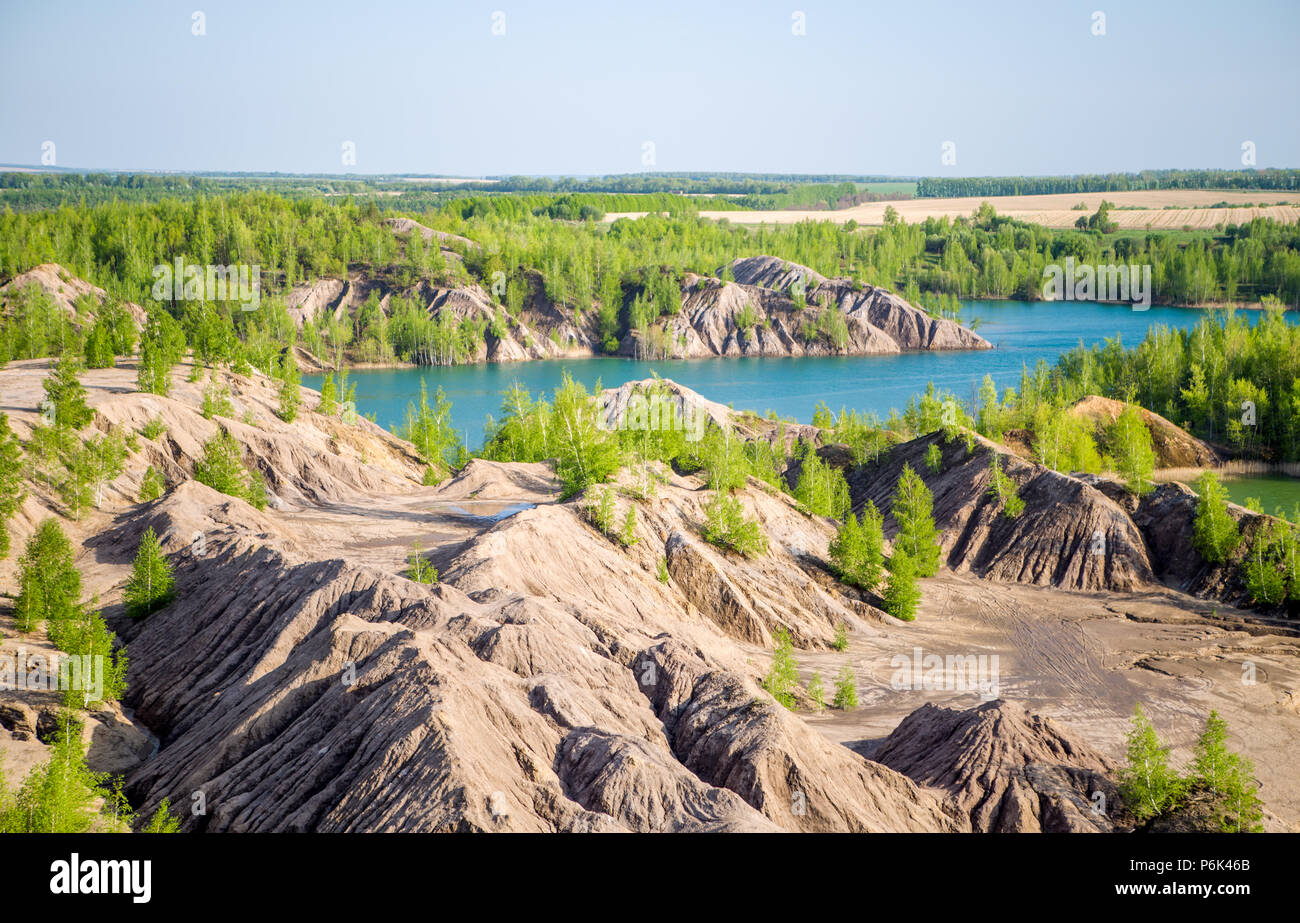 Picture of hilly terrain with green trees and river Stock Photo - Alamy
