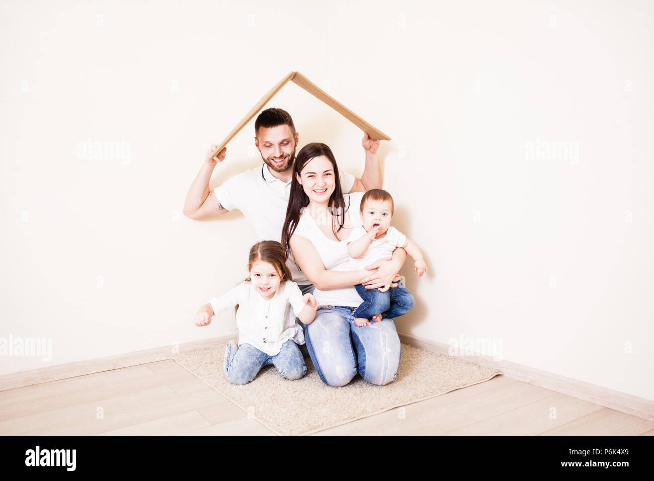 Handsome man protects his family, concept Stock Photo - Alamy