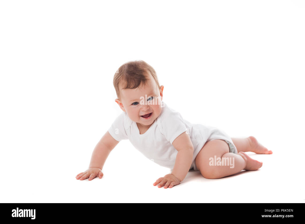 Infant child baby toddler crawling forwards Stock Photo - Alamy