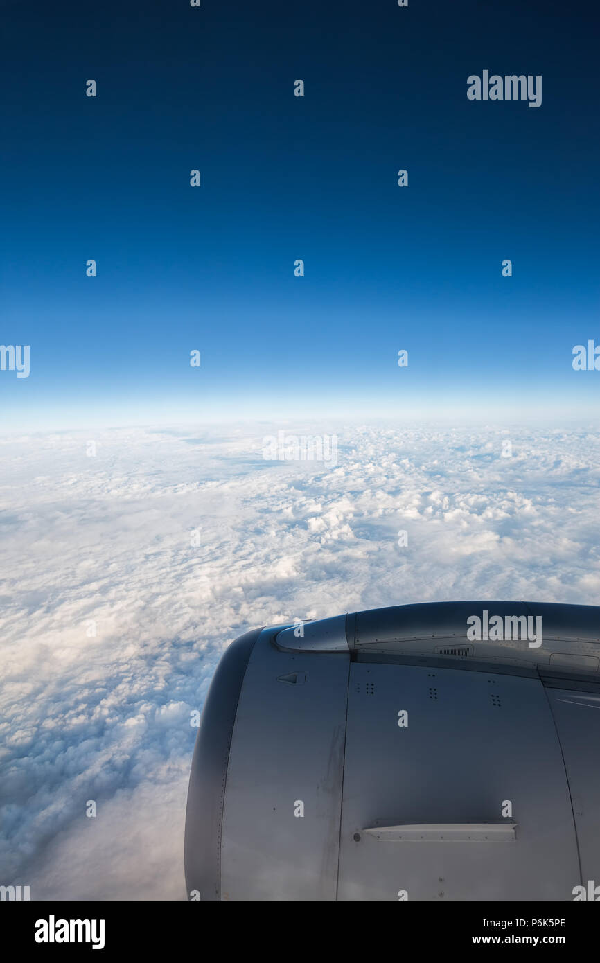 Flying above the clouds. view from the airplane Stock Photo - Alamy
