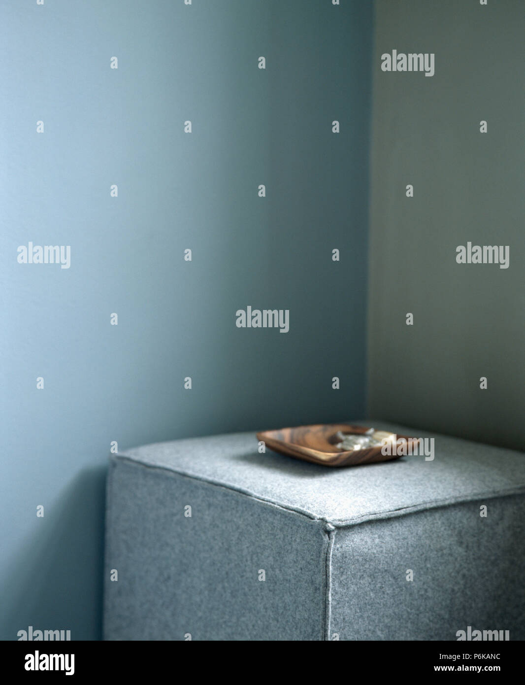 Close-up of upholstered cube stool Stock Photo - Alamy