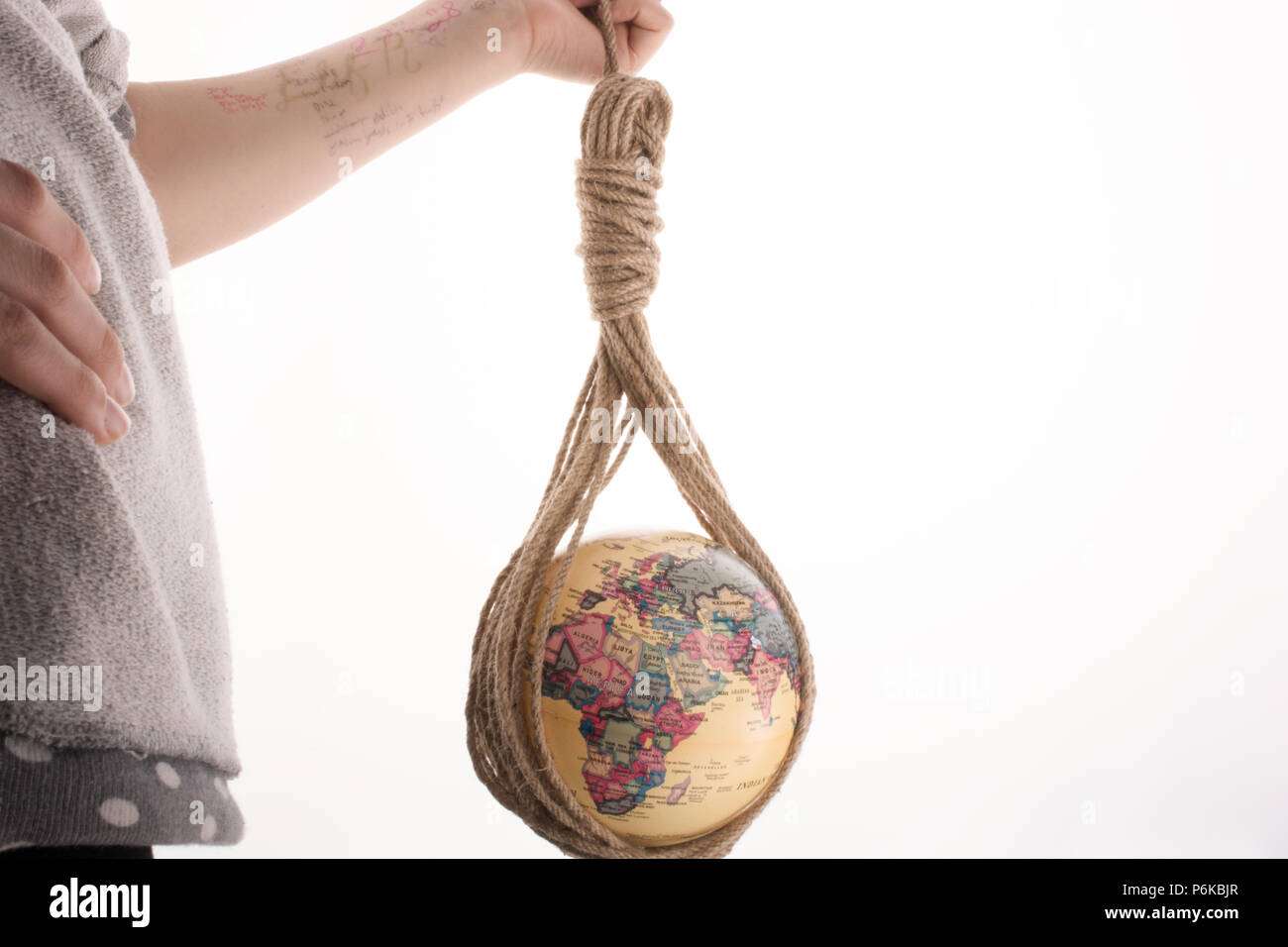 globe hanging in rope on white background Stock Photo - Alamy