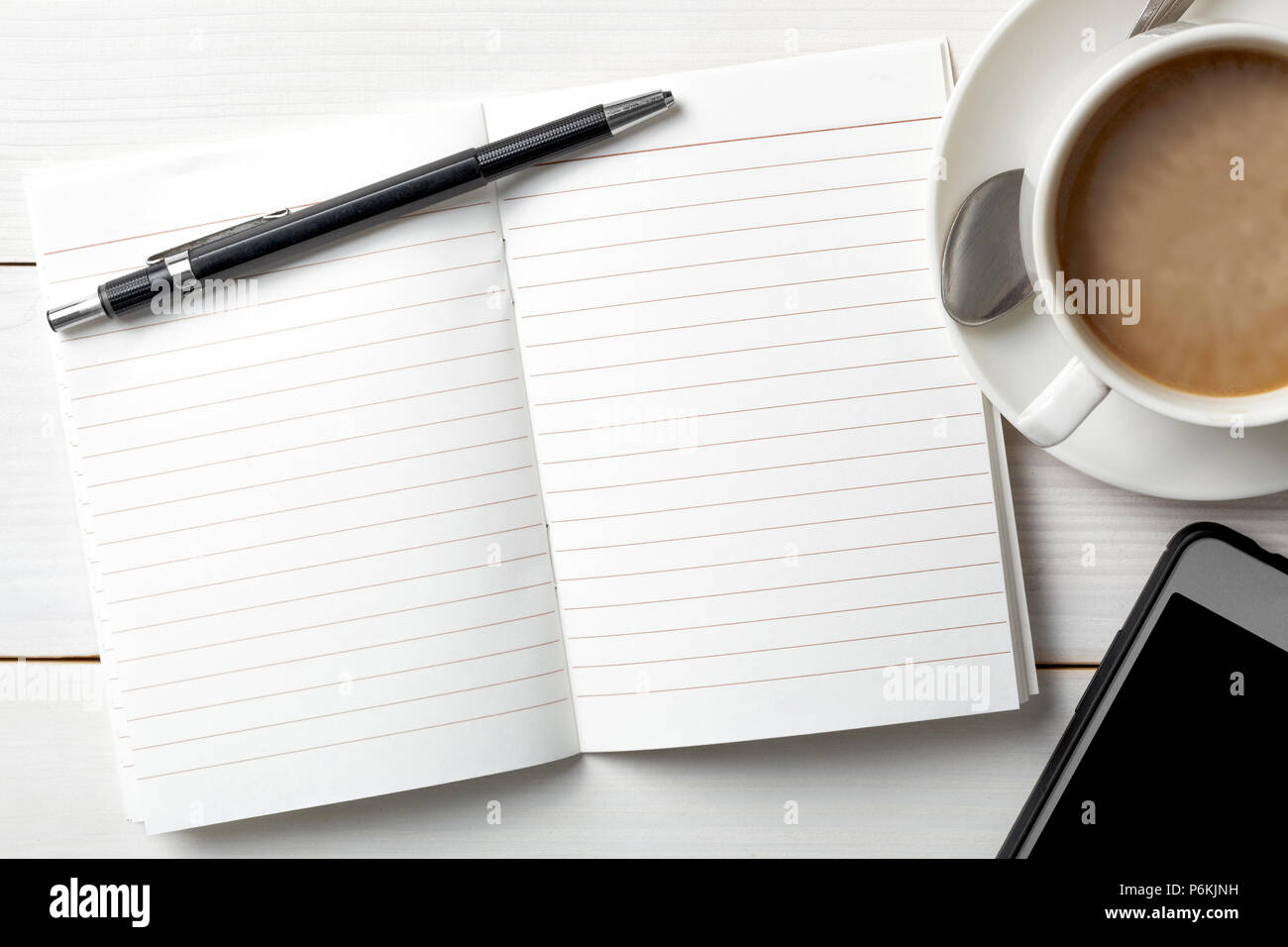 Opened personal organizer with a to do list. on white wooden background ...