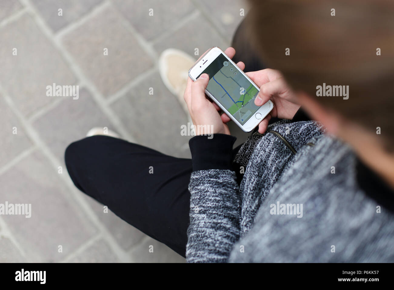 Male person using smartphone outside Stock Photo - Alamy