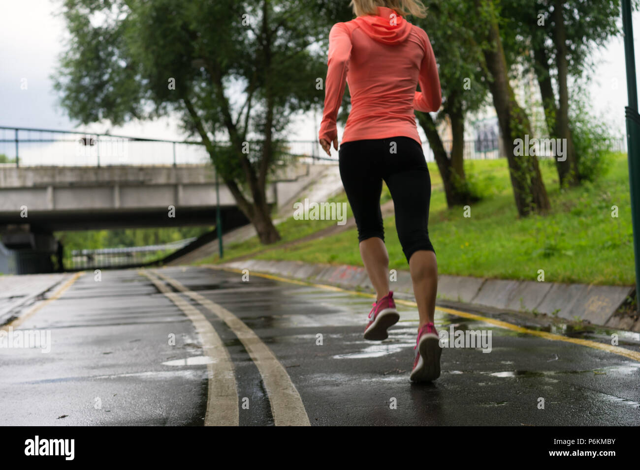 Woman Running In Rain