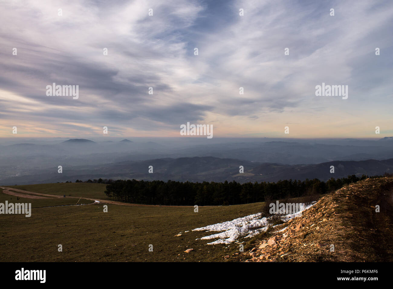 Subasio Mt. (Umbria, Italy), with sky covered by clouds and warm sunset ...