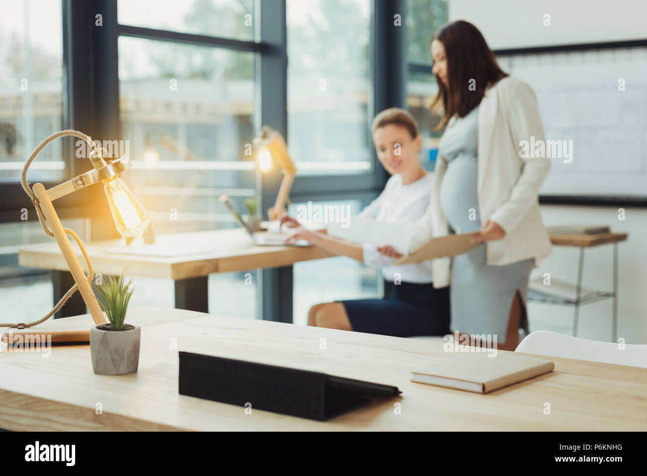 Friendly accountants talking while being in their office Stock Photo ...