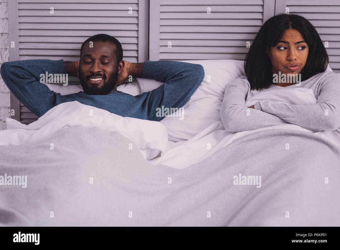 Relaxed male person keeping smile on face Stock Photo - Alamy