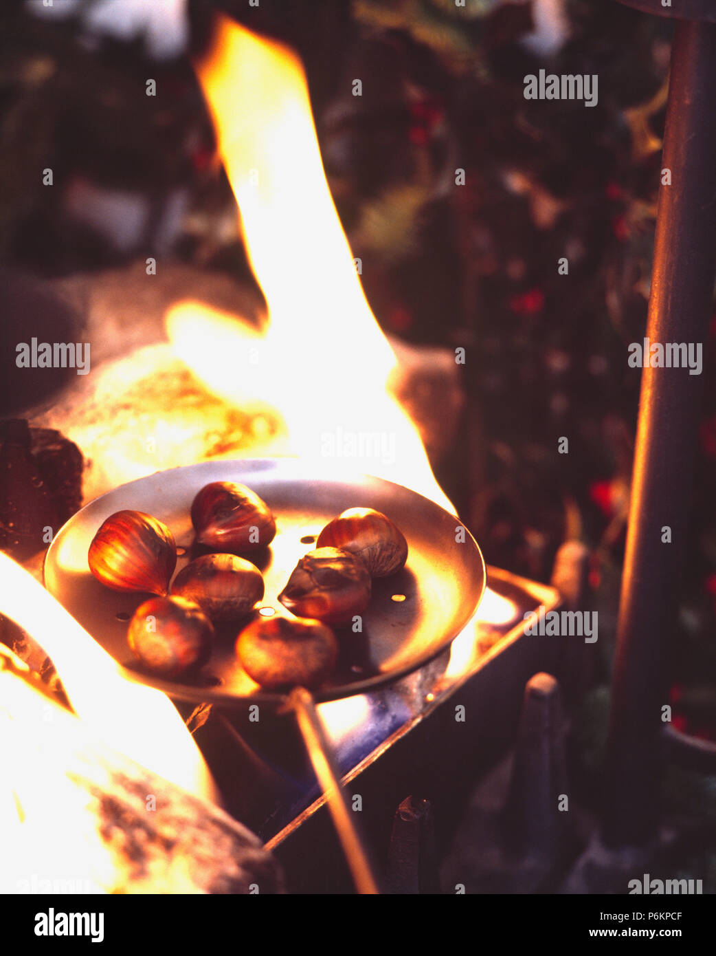 Chestnuts roasting by an open fire hi-res stock photography and images ...