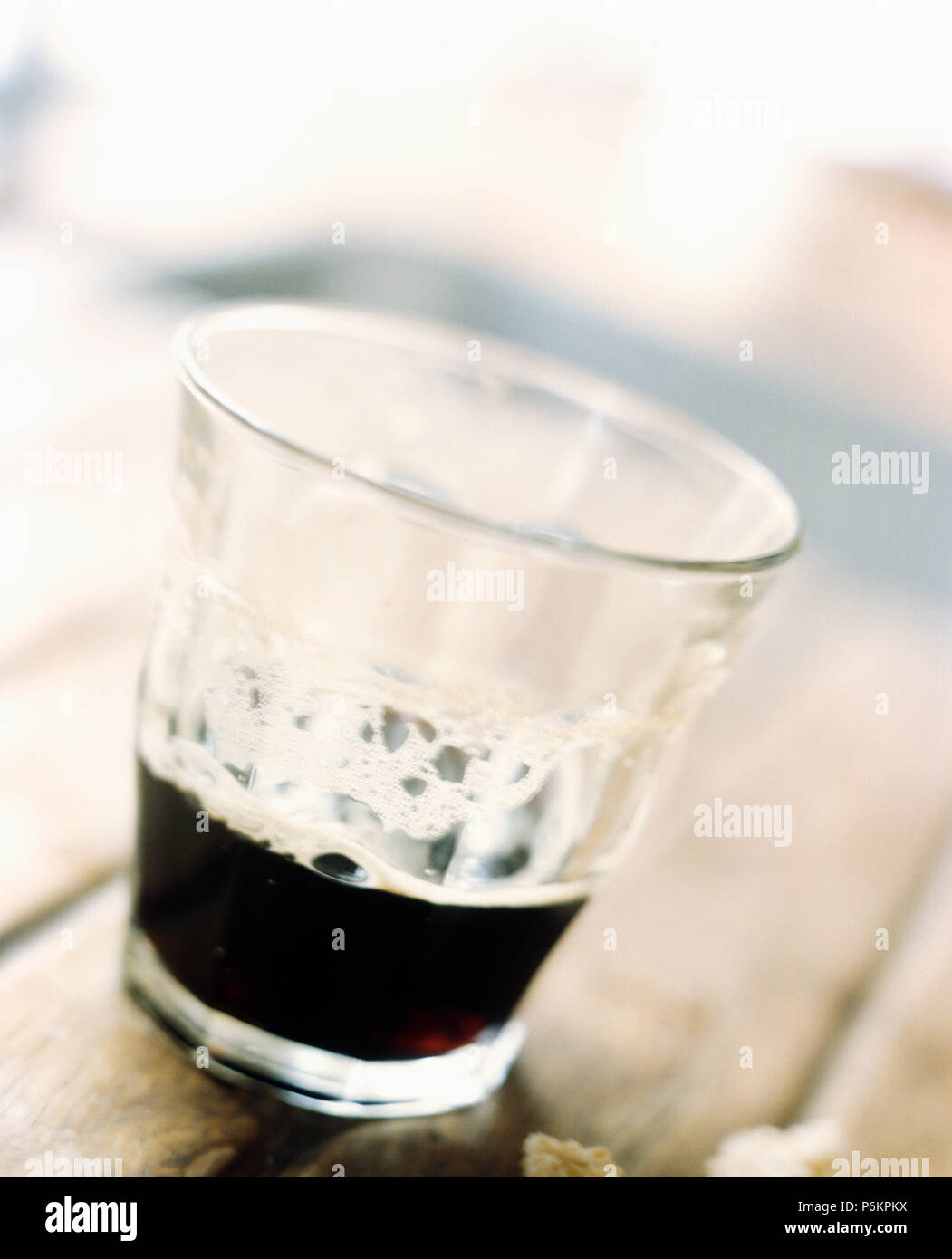 Close-up of half-full glass of Cola Stock Photo - Alamy
